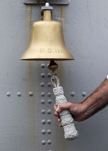 The USS Cod submarine bell is rung in honor of each of the 70 crewmen ...